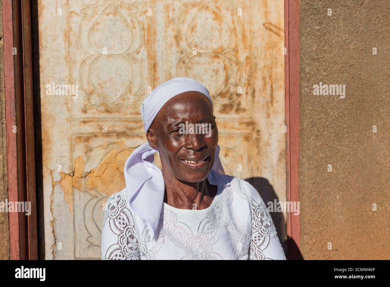 village single zezuru old african woman wearing a headscarf sited in ...