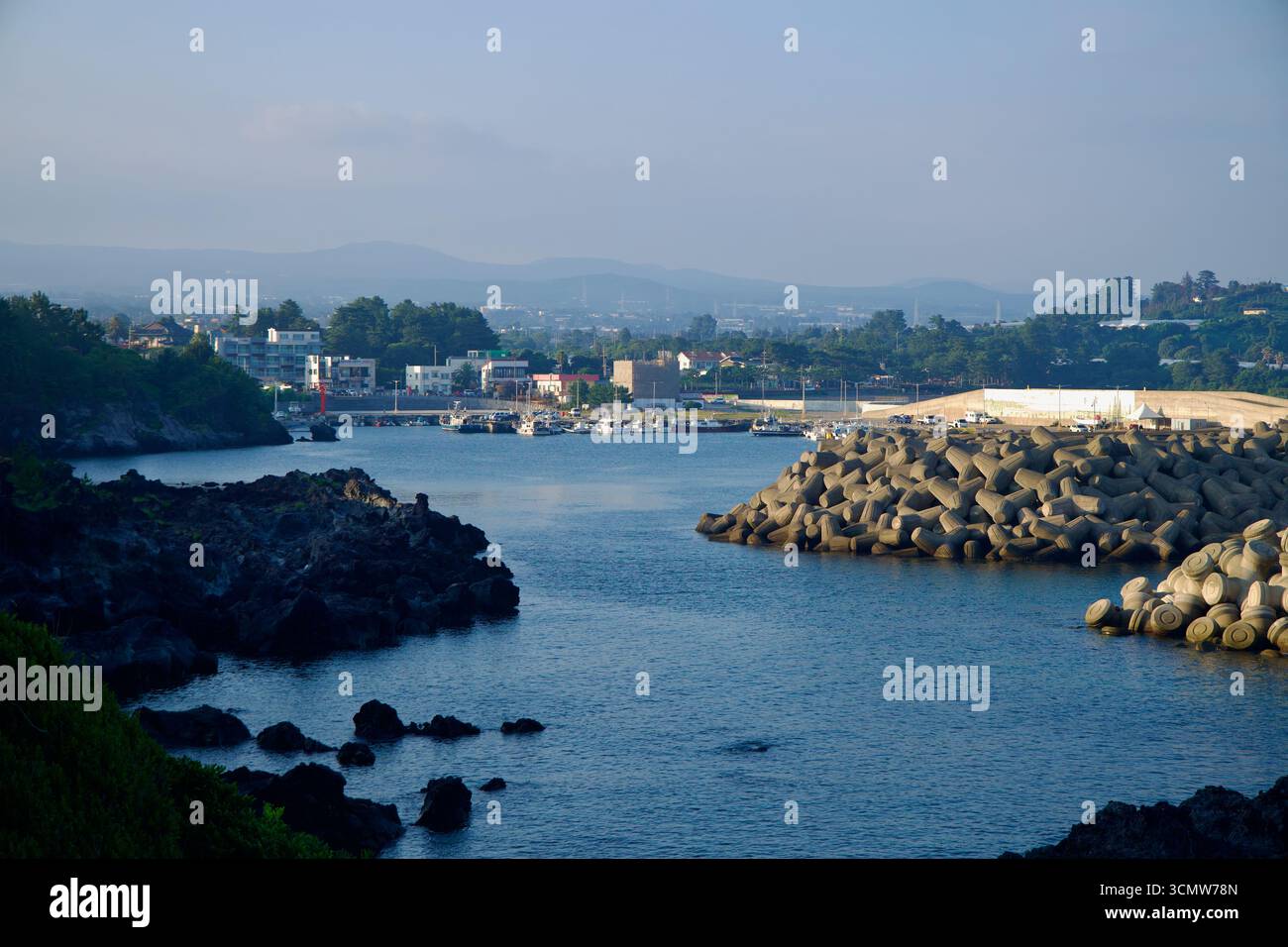 Looking into Hahyo Port, fishing boats lie in the inner basin beside ...