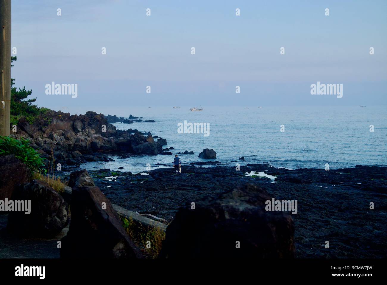 A rocky basalt shoreline near Mangjang Port faces the open sea as ...