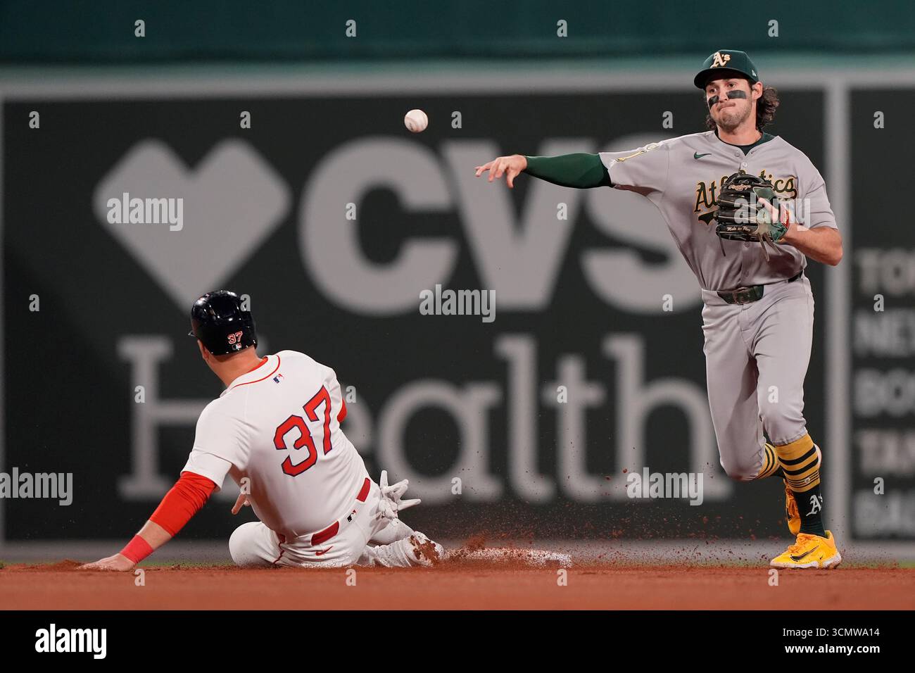 Athletics shortstop Jacob Wilson turns a double play on the force out ...