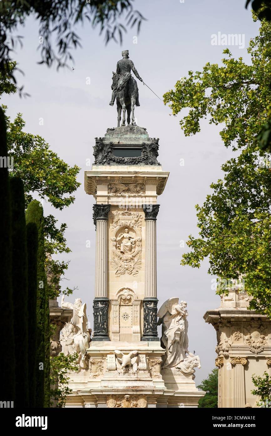 The monument in El Retiro Park features an equestrian statue of King ...