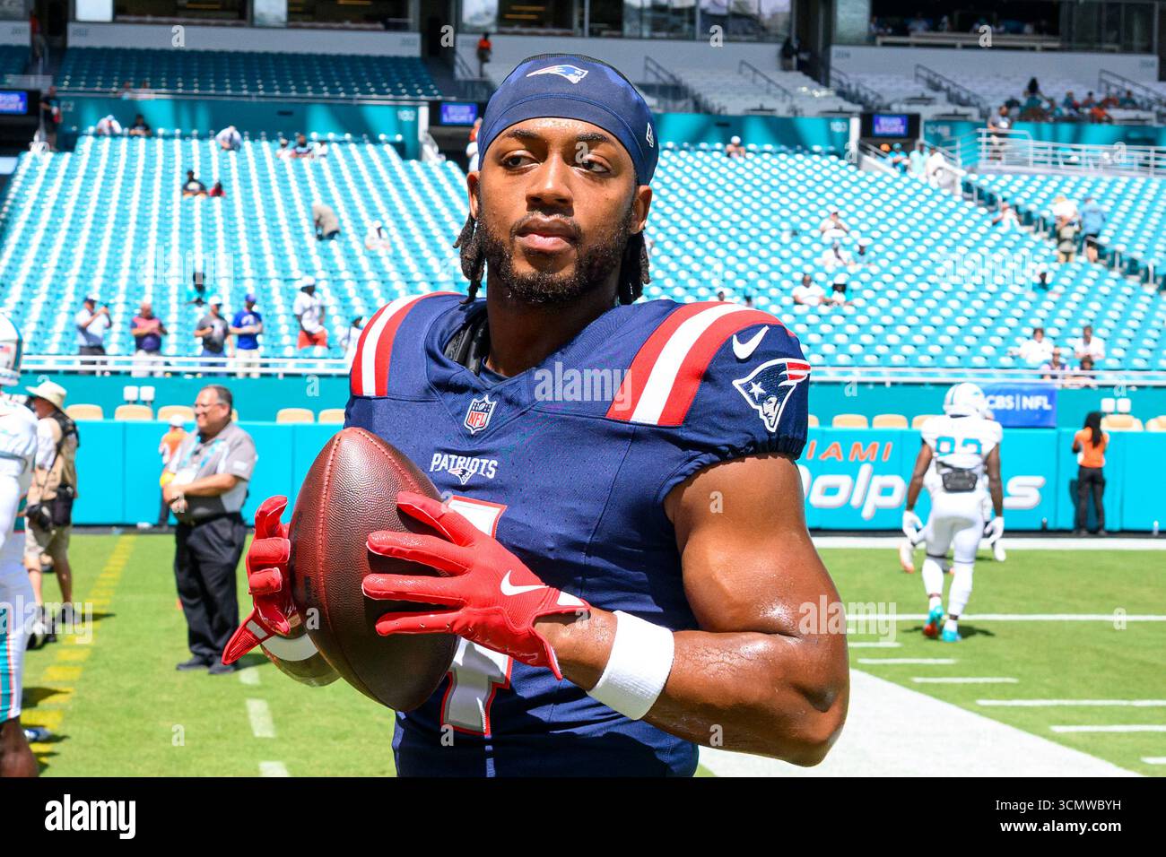 New England Patriots running back Antonio Gibson (4) holds a football ...