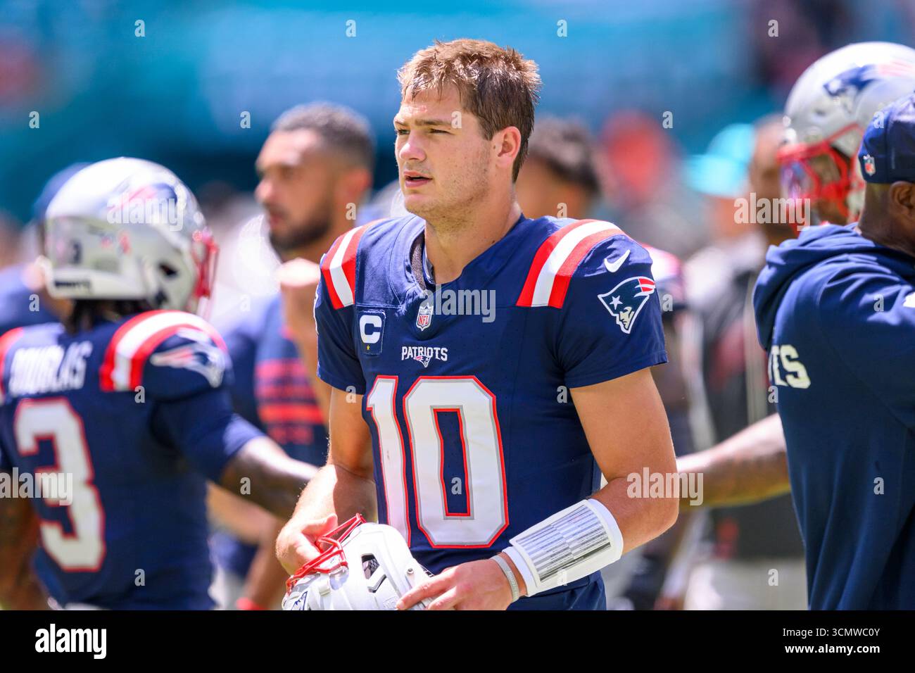 New England Patriots quarterback Drake Maye (10) walks on the field ...
