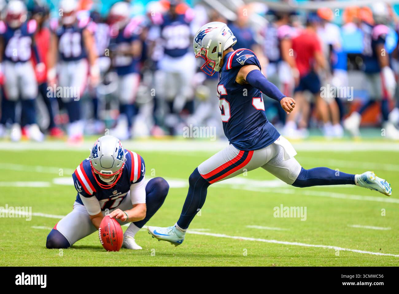 New England Patriots punter Bryce Baringer (17) holds the ball as ...