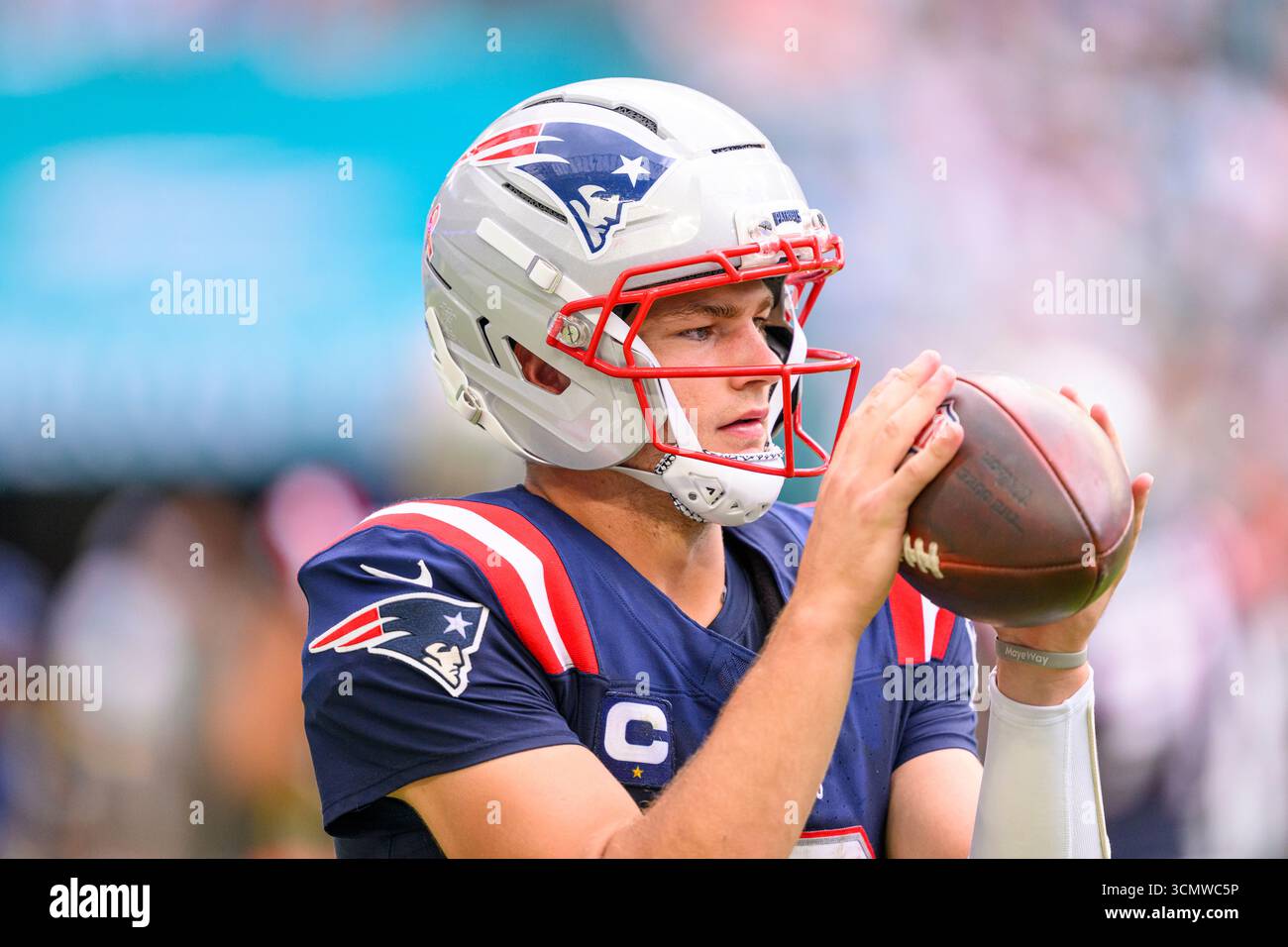 New England Patriots quarterback Drake Maye (10) holds the football ...