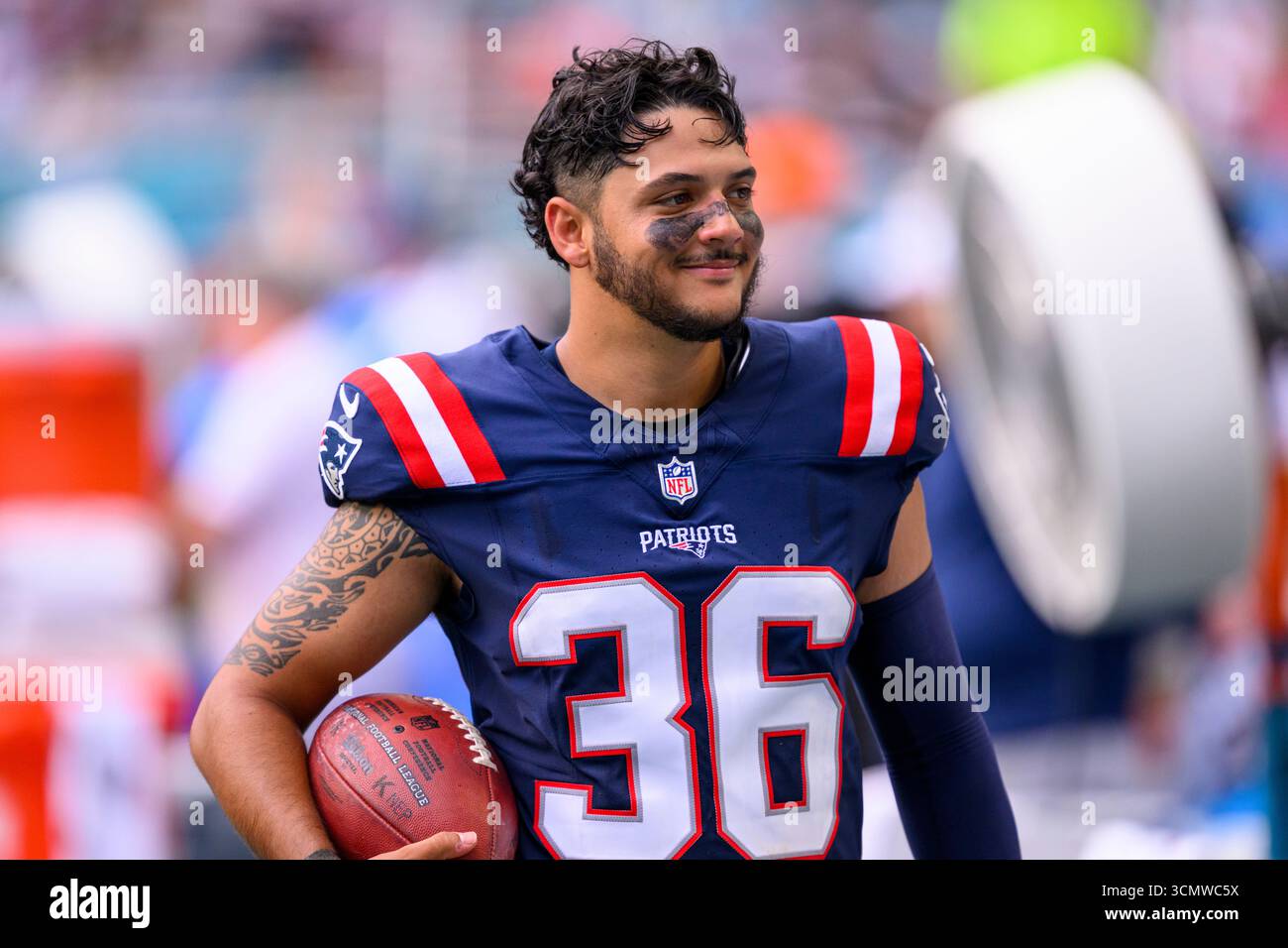 New England Patriots kicker Andy Borregales (36) smiles as he holds a ...