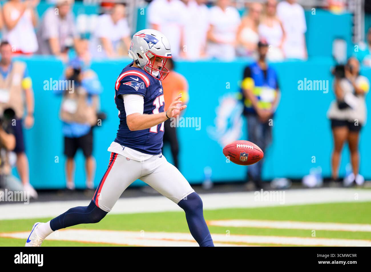 New England Patriots punter Bryce Baringer (17) punts the ball during an NFL football game ...