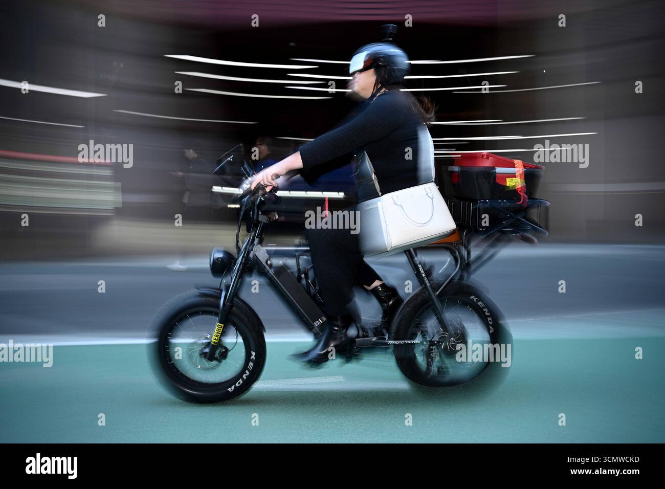 People are seen riding E-Bikes in Sydney, Wednesday, September 17, 2025 ...