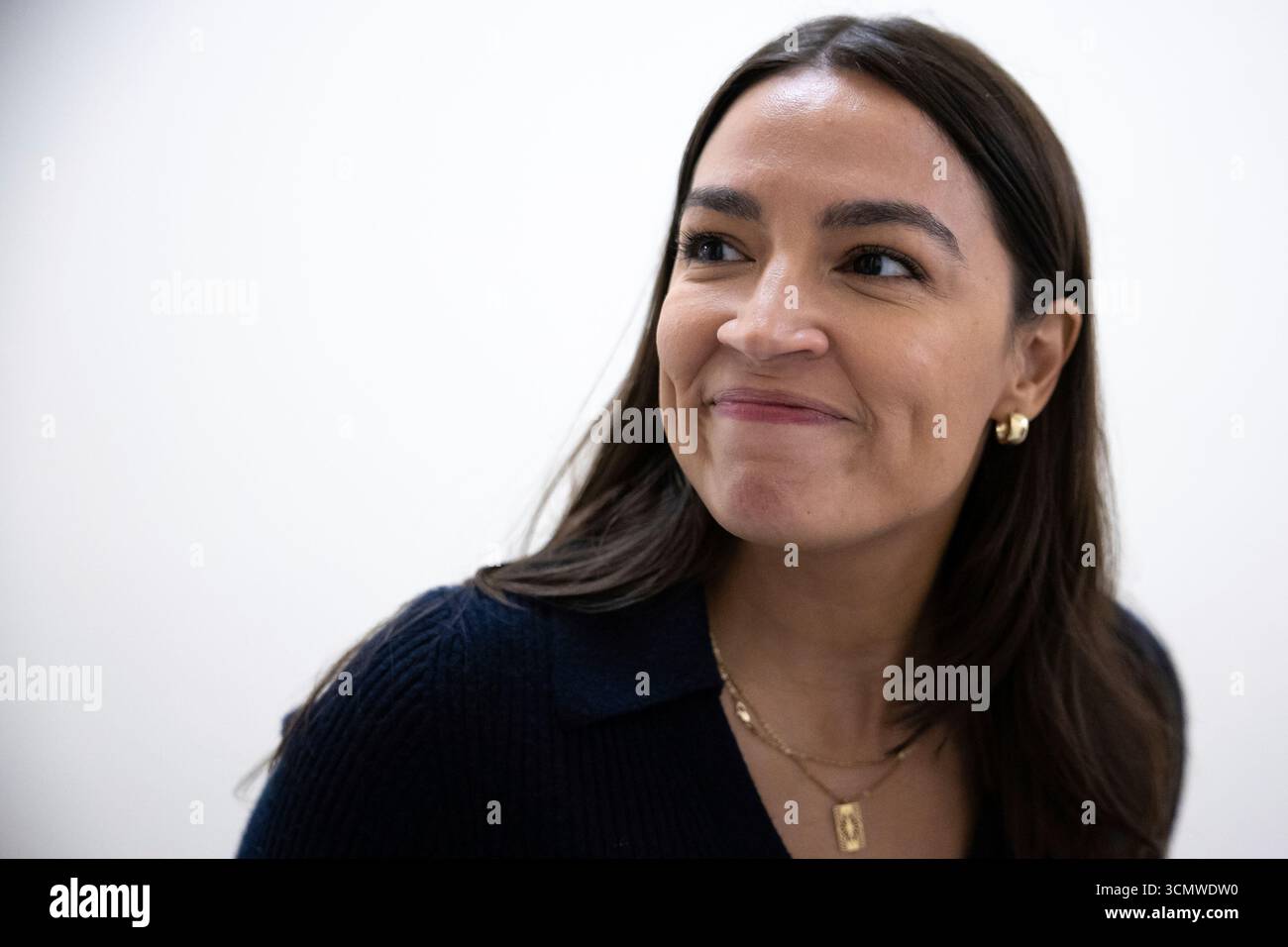 Rep. Alexandria Ocasio-Cortez (D-N.Y.) speaks with a reporter as she ...