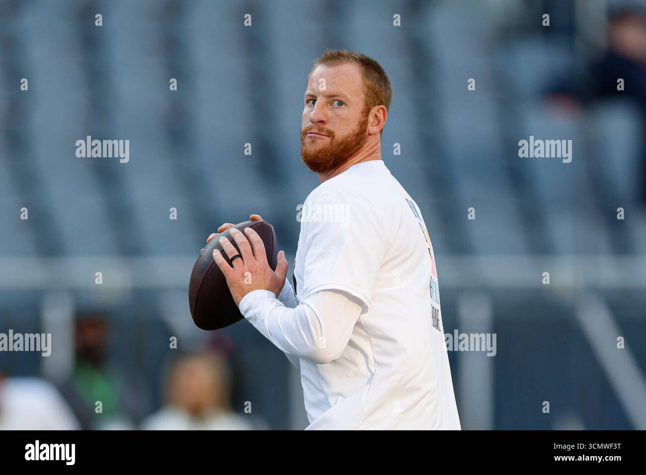 Minnesota Vikings quarterback Carson Wentz (11) warms up before an NFL ...