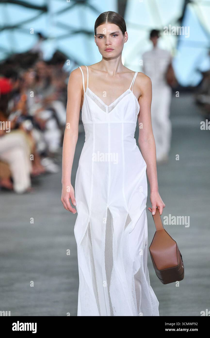 A model walks the runway wearing a design by Simorra during the ...