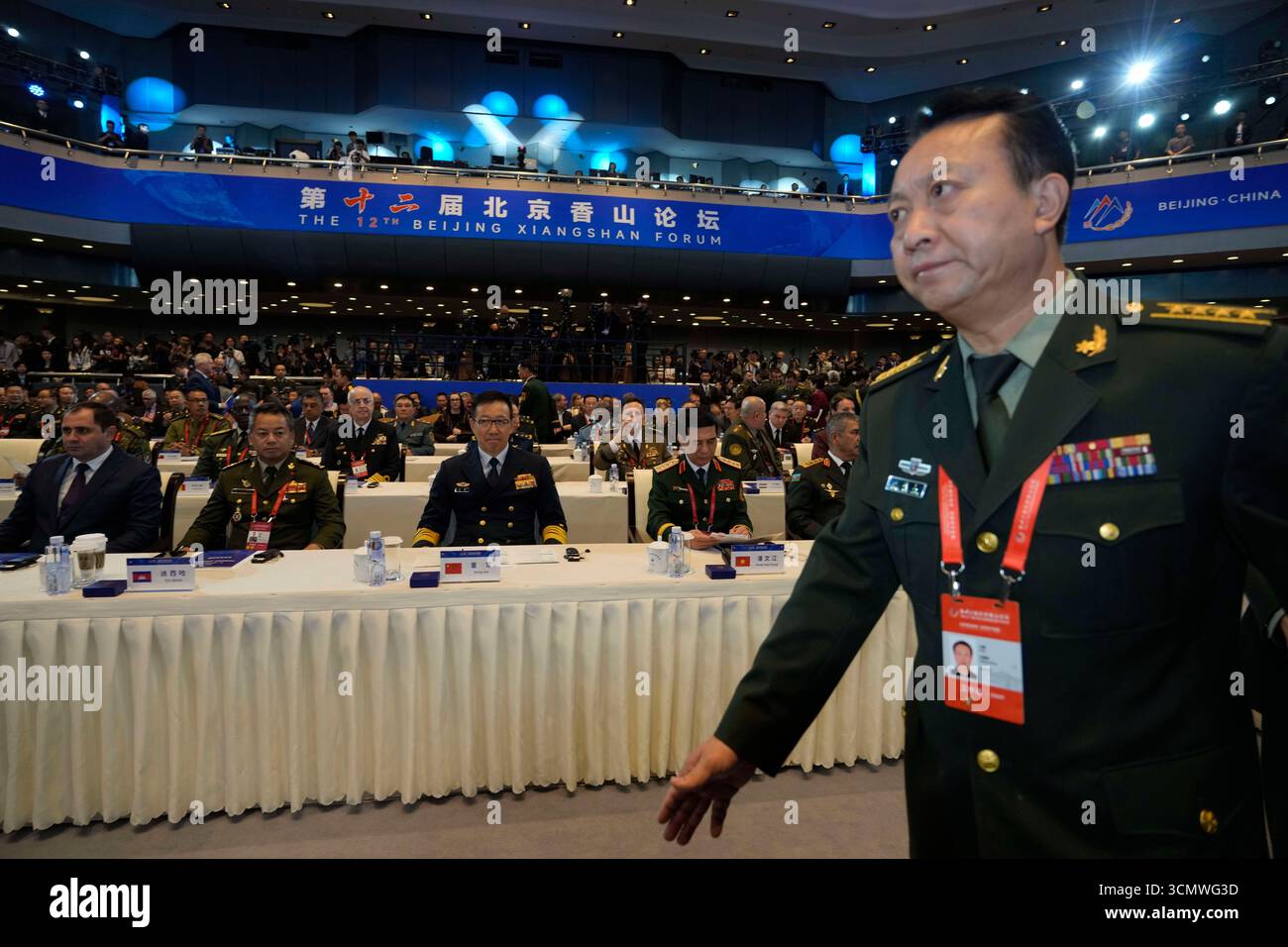 Chinese Defense Minister Dong Jun, sitting in front center, attends ...