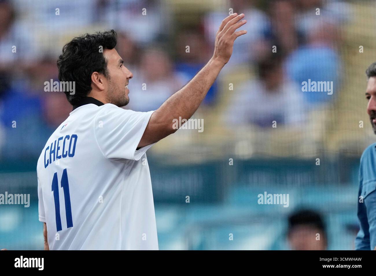 Cadillac Formula 1 driver Sergio Perez waves before the Los Angeles ...