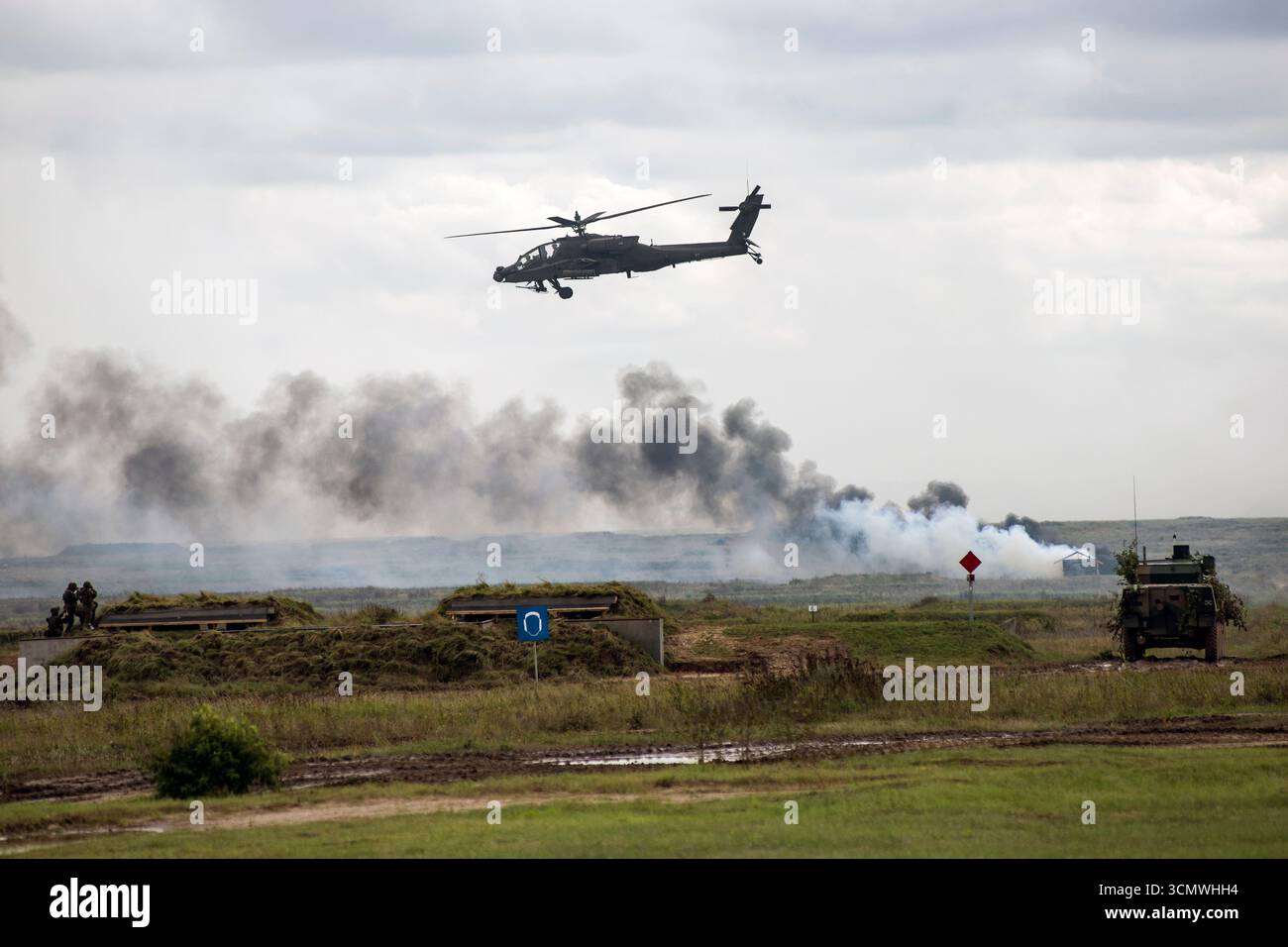 AH-64D Apache helicopters hover during military exercises of Poland and ...