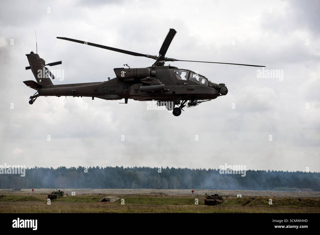 AH-64D Apache helicopters hover during military exercises of Poland and ...
