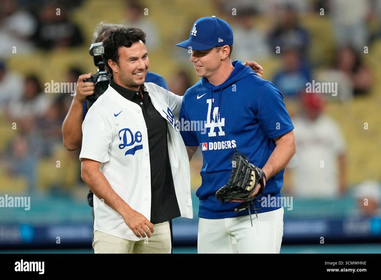 Cadillac Formula 1 driver Sergio Perez, left, greets Los Angeles ...