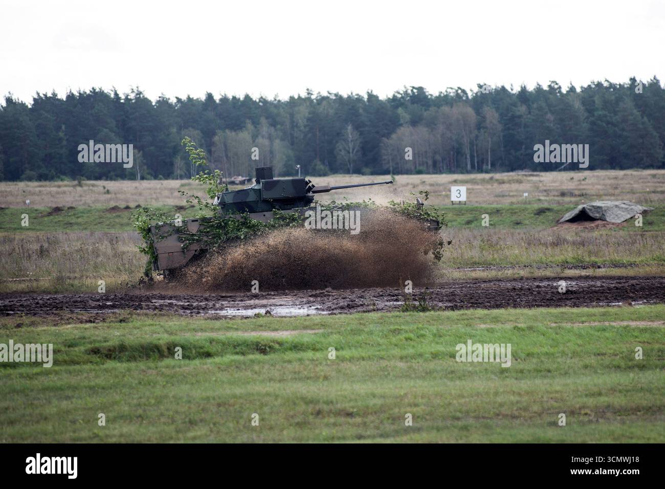 An armored vehicle drives during military exercises of Poland and NATO ...