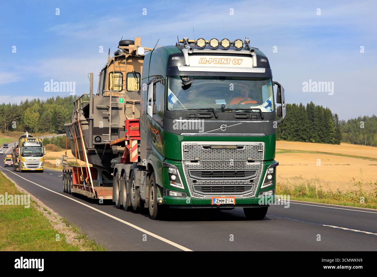 Volvo FH16 truck JR Point Oy hauls naval vessel on low loader trailer ...