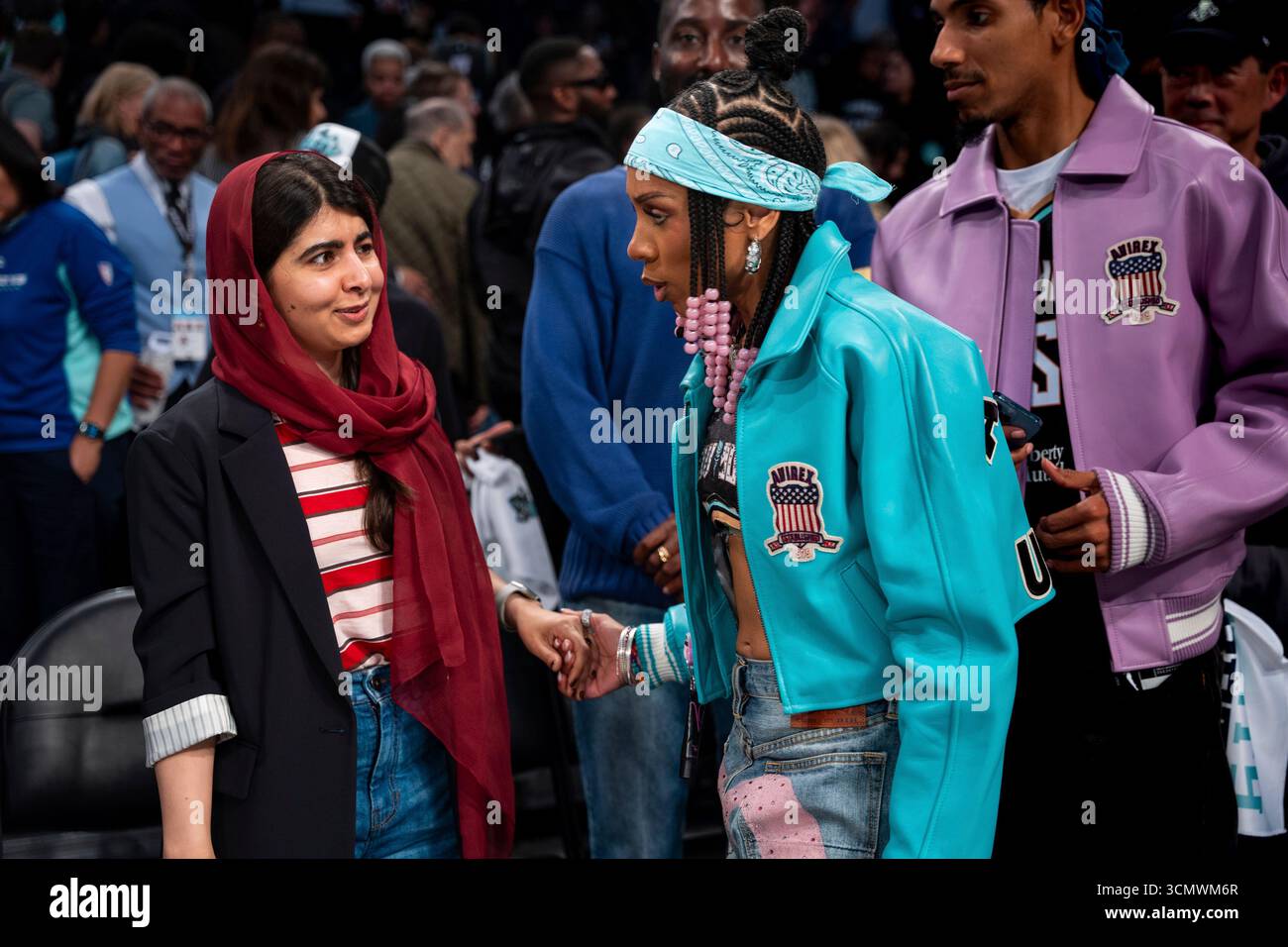 Malala Yousafzai, Nobel Prize laureate, left, greets rapper Lil Mama ...
