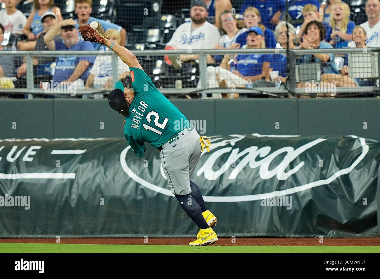 Seattle Mariners first baseman Josh Naylor catches a fly foul ball for the out on Kansas City ...