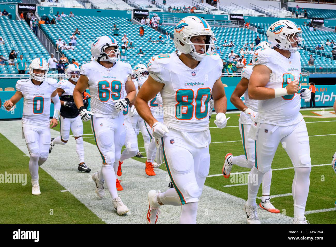 Miami Dolphins tight end Tanner Conner (80), defensive tackle Jordan ...