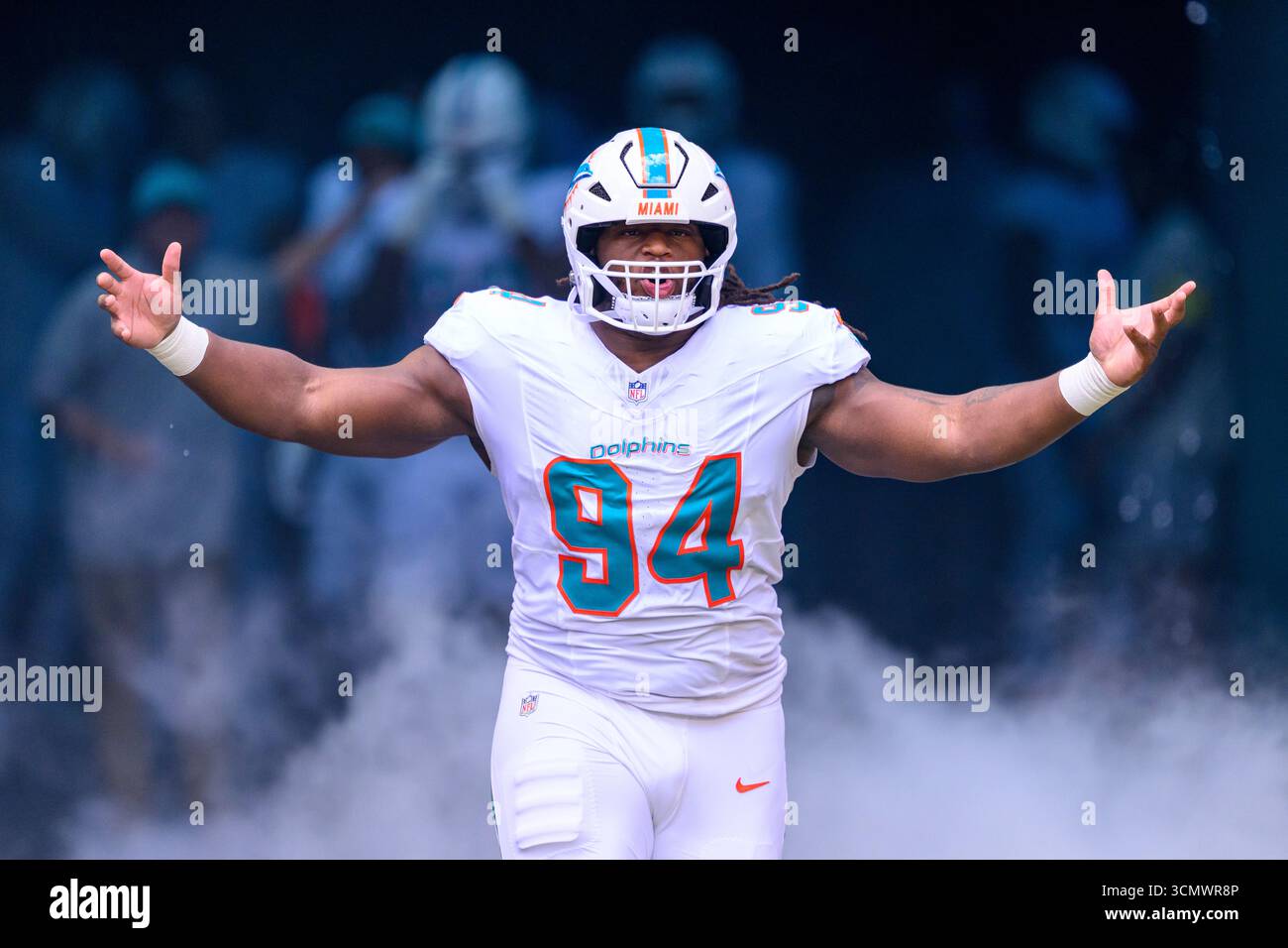Miami Dolphins defensive tackle Jordan Phillips (94) gestures as he ...