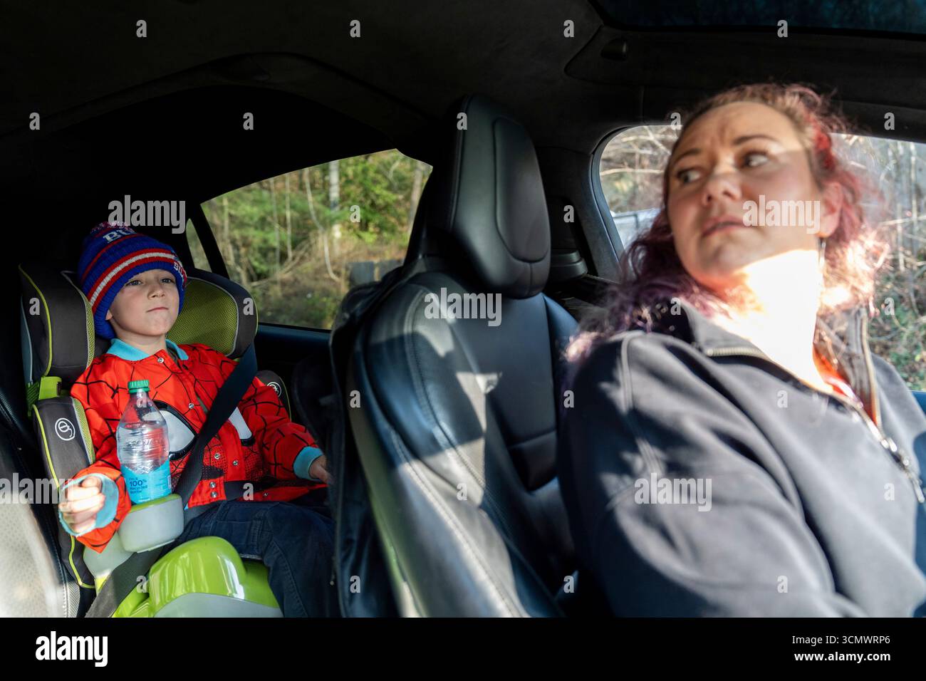 Terri Dolan, right, talks with her son, Fisher, after picking him up ...