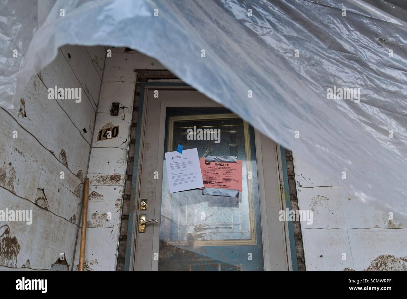 A sign from county officials declares Natalie Brigg's home is ...