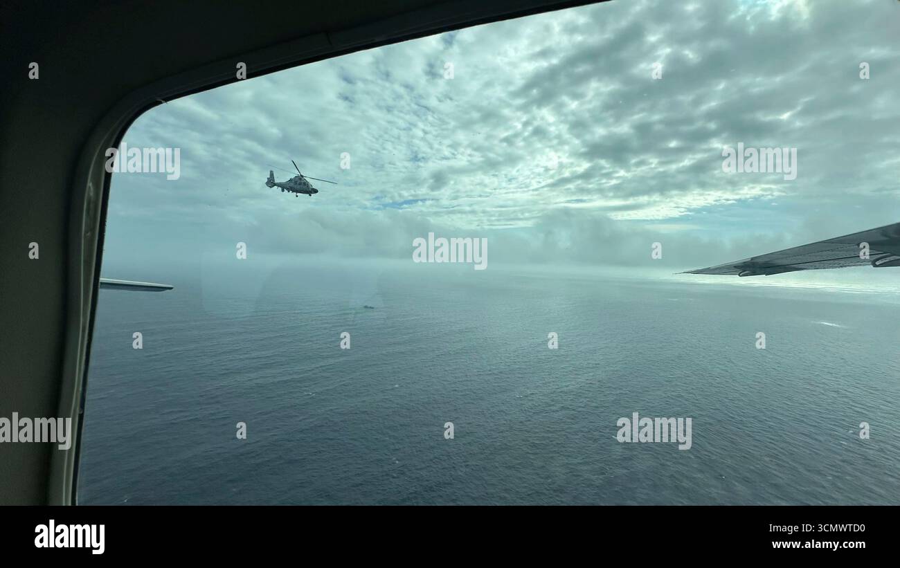 FILE - A Chinese military helicopter flies close to a Philippine Bureau ...