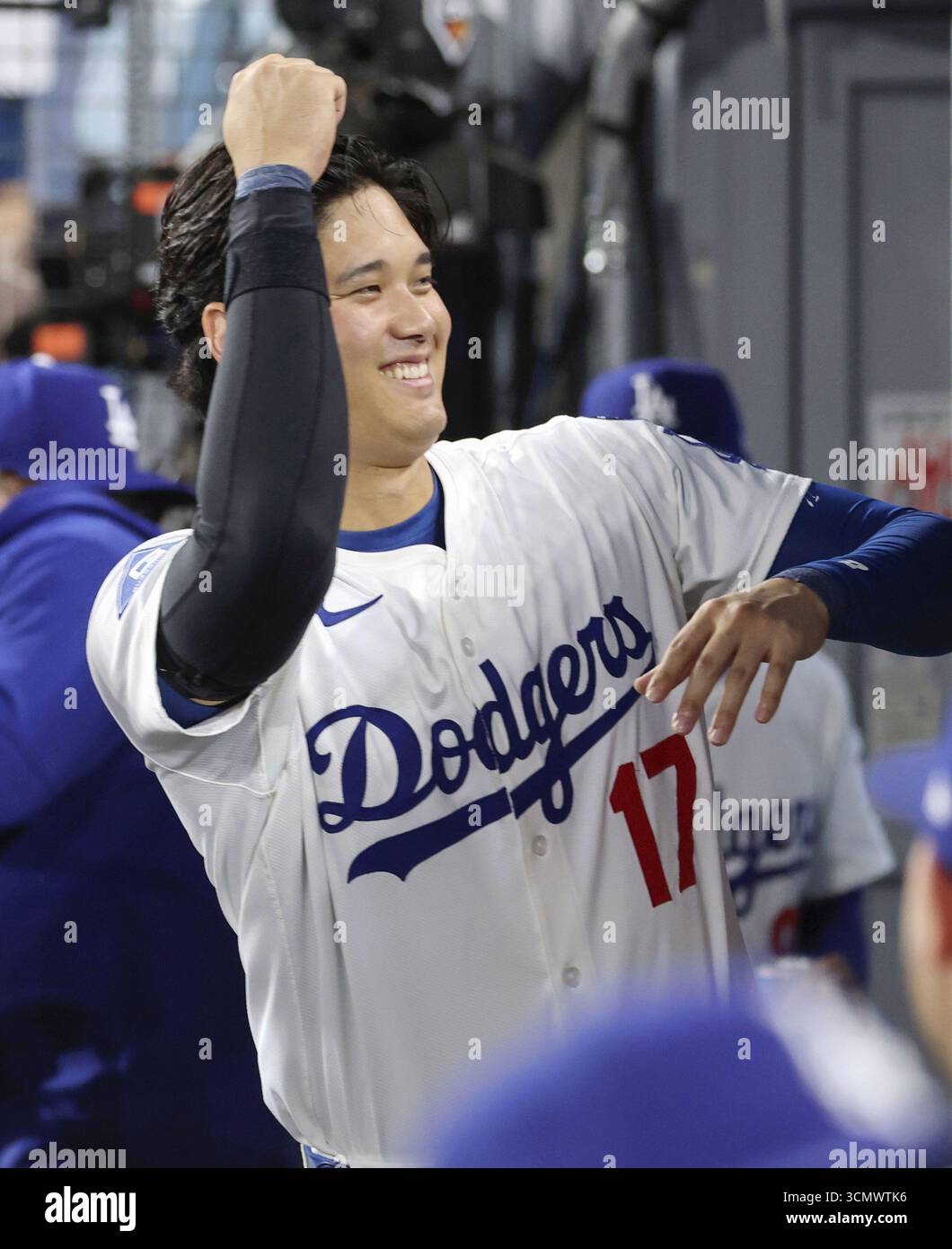 Los Angeles Dodgers designated hitter Shohei Ohtani smiles in the ...