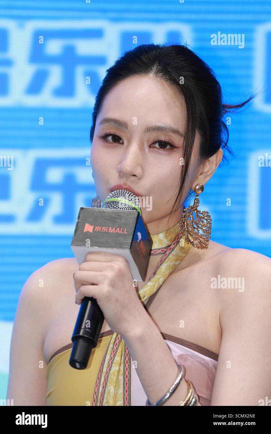 Chinese pop singer Liu Xijun attends an activity in Shenzhen City ...