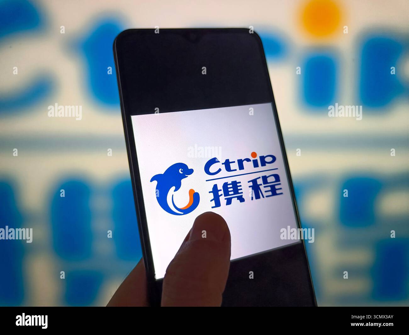 SUQIAN, CHINA - SEPTEMBER 18, 2025 - An illustration photo shows Ctrip logo in a smartphone in ...