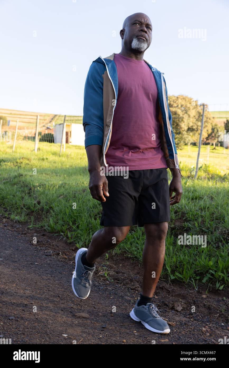 Contemplative black african male walking hi-res stock photography and ...