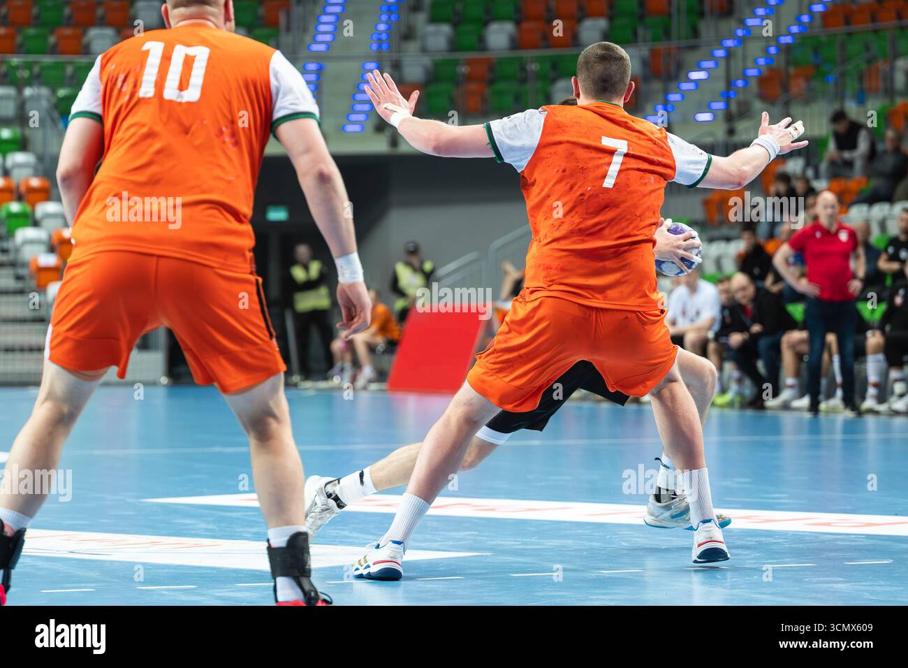 Backs of handball players during the game Stock Photo - Alamy