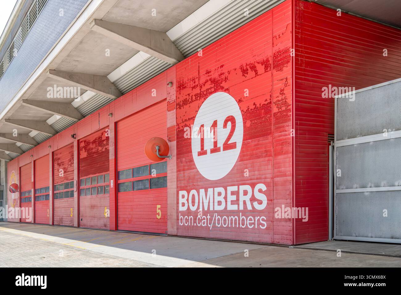 Red Fire Station Building With Large Garage Doors And Emergency ...