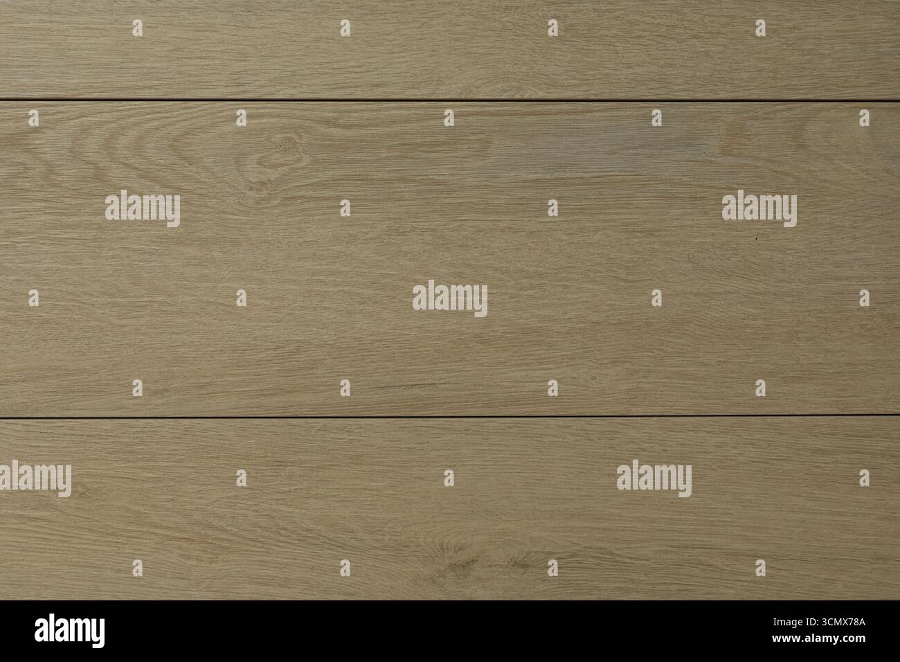 Natural light wood flooring with a smooth texture and warm tones in a ...