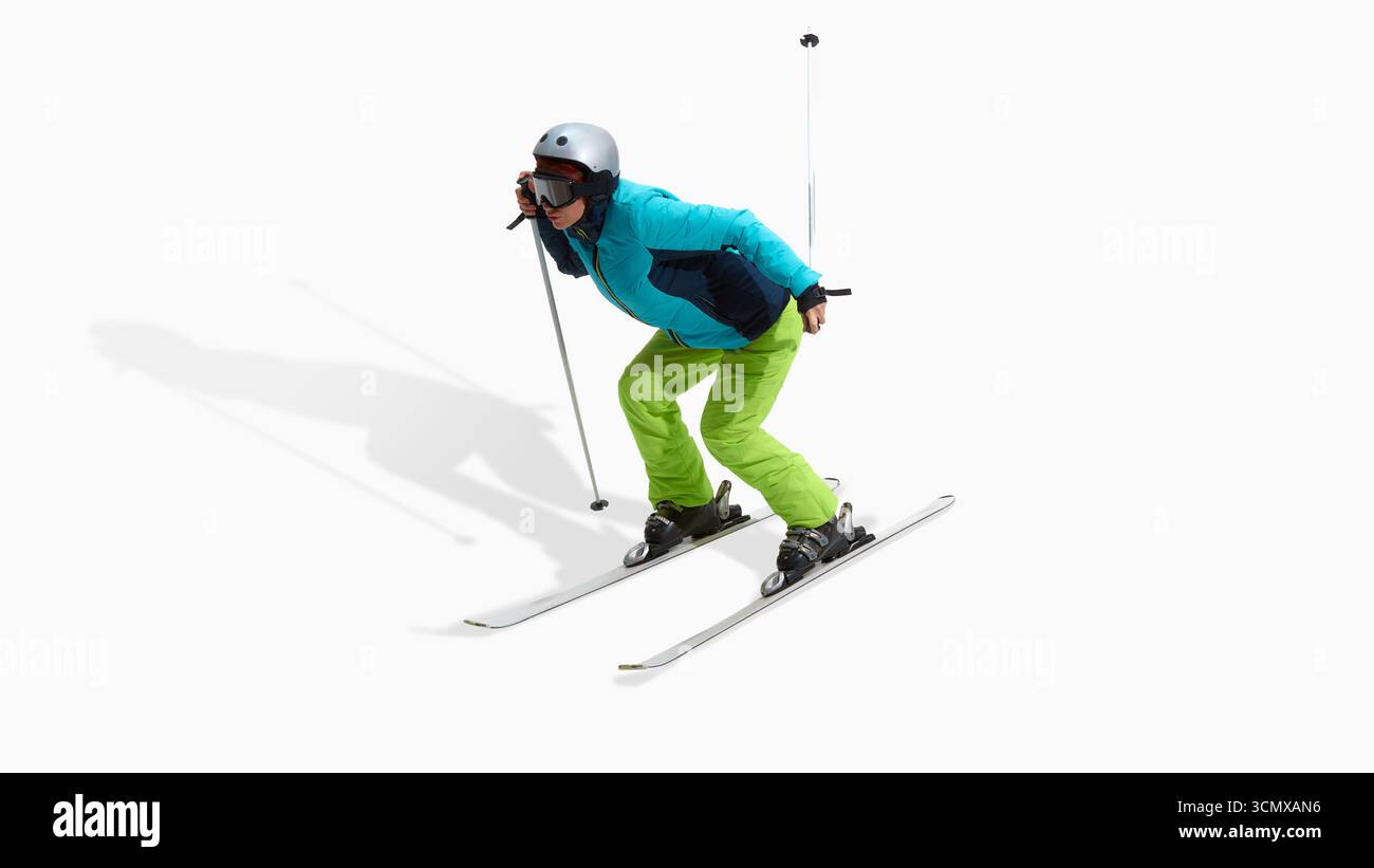 Female skier in bright outfit leaning forward in active downhill pose ...