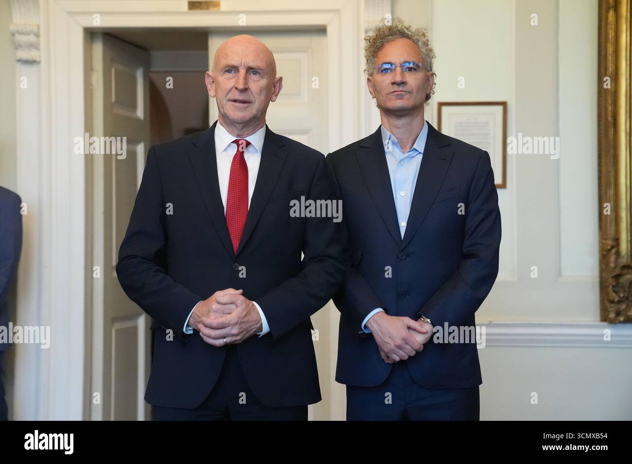 Defence Secretary John Healey (left) and the CEO of software company ...