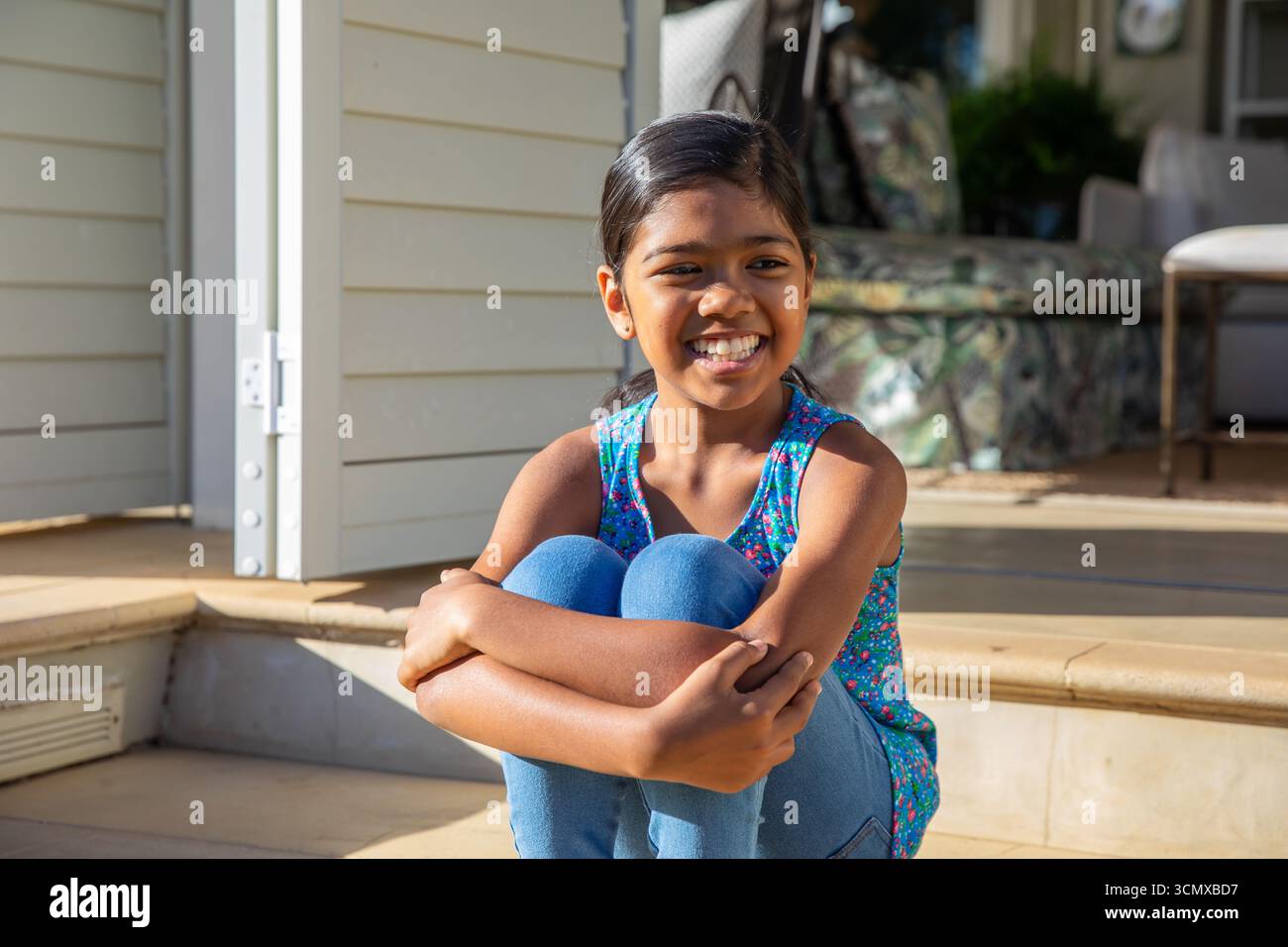 Child child sitting on steps hi-res stock photography and images - Alamy