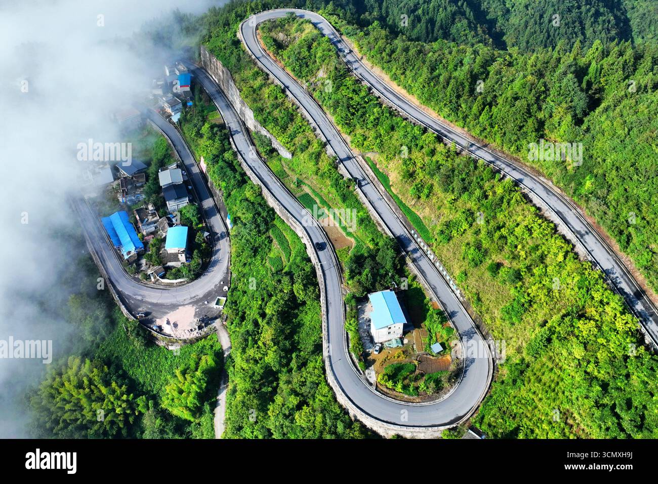 Aerial photo shows the winding mountain road in Youyang County ...