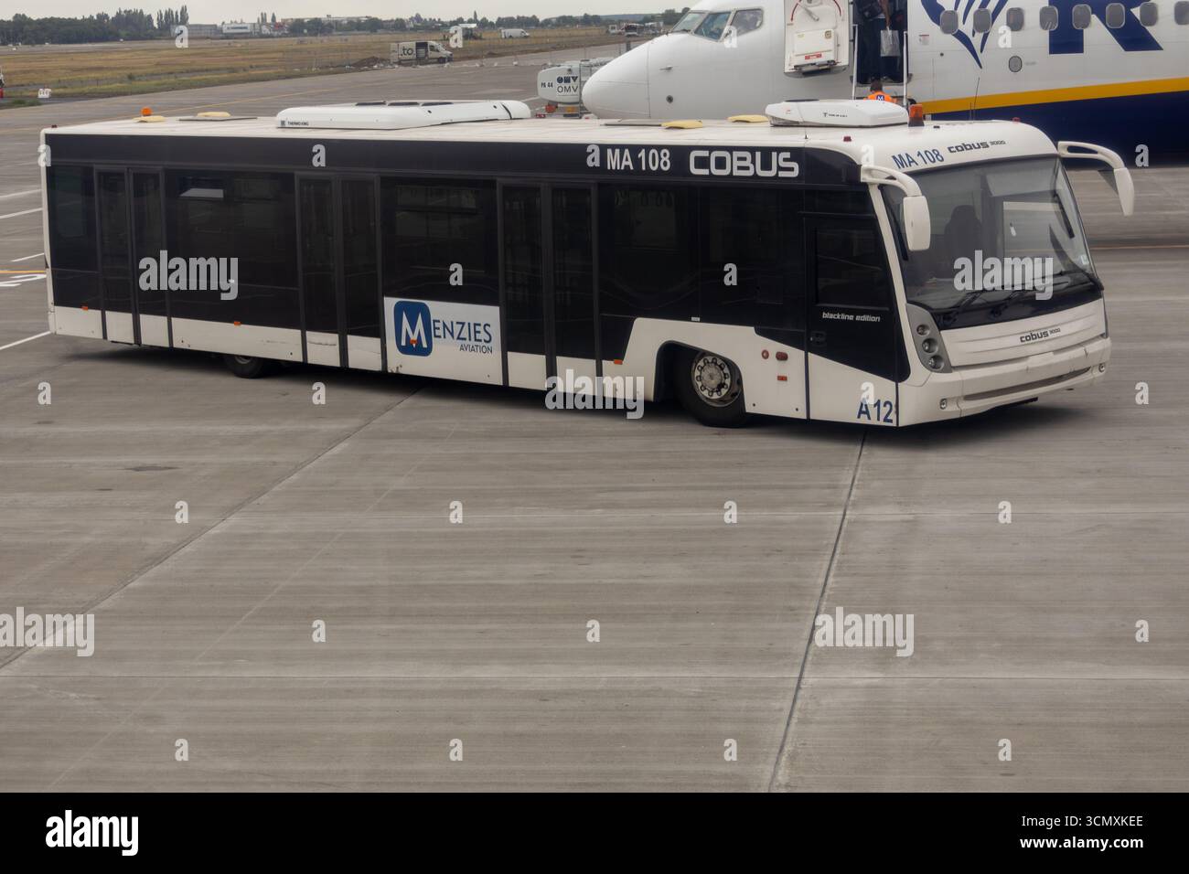 Black and white Cobus airport shuttle bus used for transporting ...
