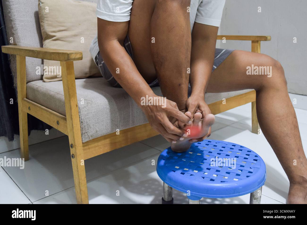 foot pain, young man suffering from feet ache in home, podiatry concept ...