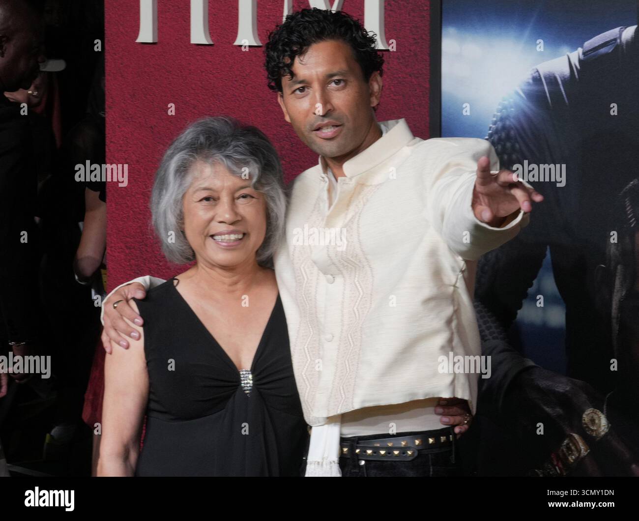 (R-L) Justin Tipping and Mom at the Universal Pictures' HIM Premiere held at the TCL Chinese ...