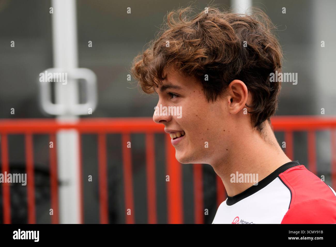 Haas driver Oliver Bearman of Britain walks through the paddock at the Baku City Circuit, ahead ...
