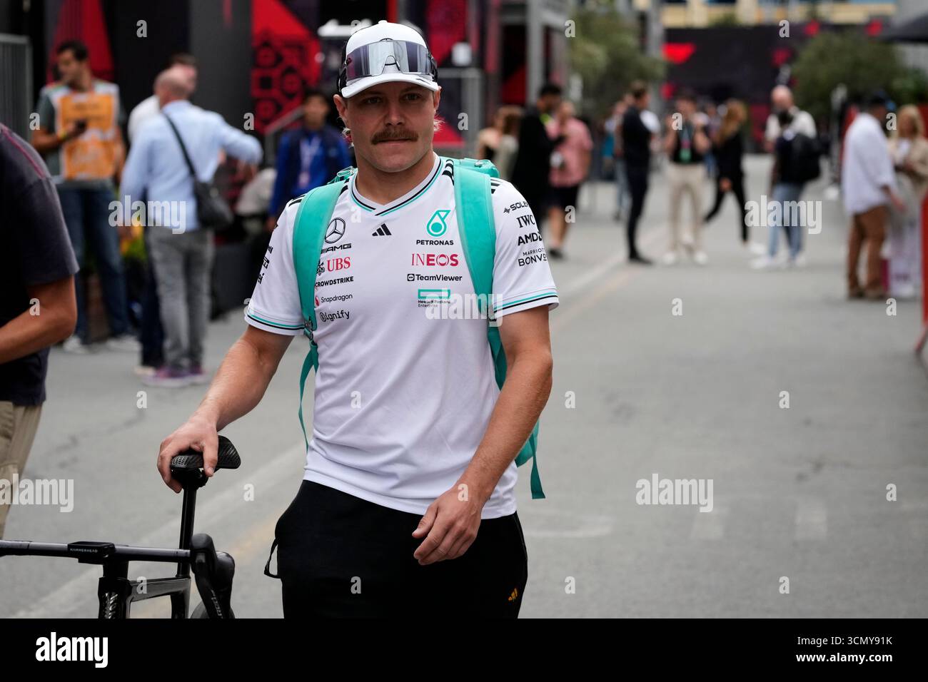 Mercedes reserve driver Valeri Bottas of Finland walks through the ...