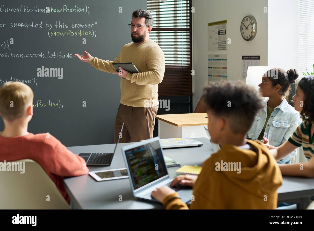 Teacher student collaborate on coding hi-res stock photography and ...