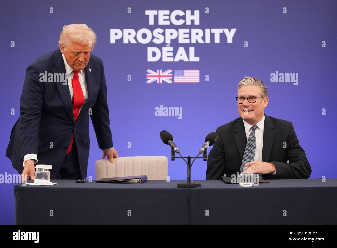 President Donald Trump takes his seat for a joint press conference with ...