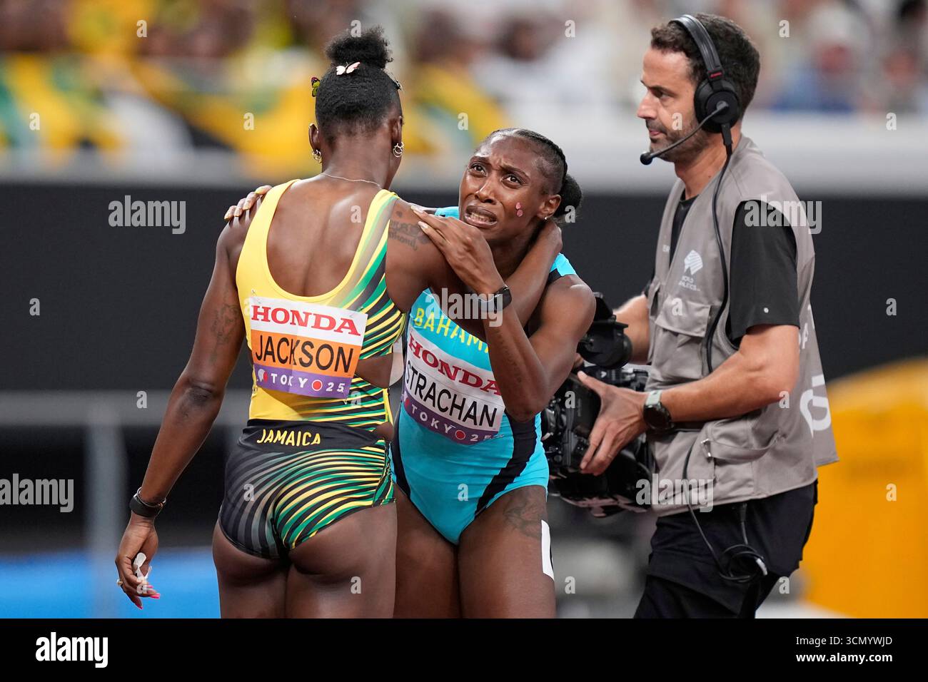 Bahamas' Anthonique Strachan, center, reacts after competing in women's ...