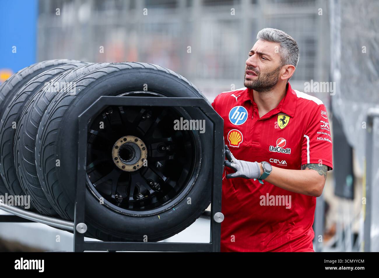 BAKU, AZERBAIJAN - SEPTEMBER 18: A Ferrari Mechanic looks on during ...
