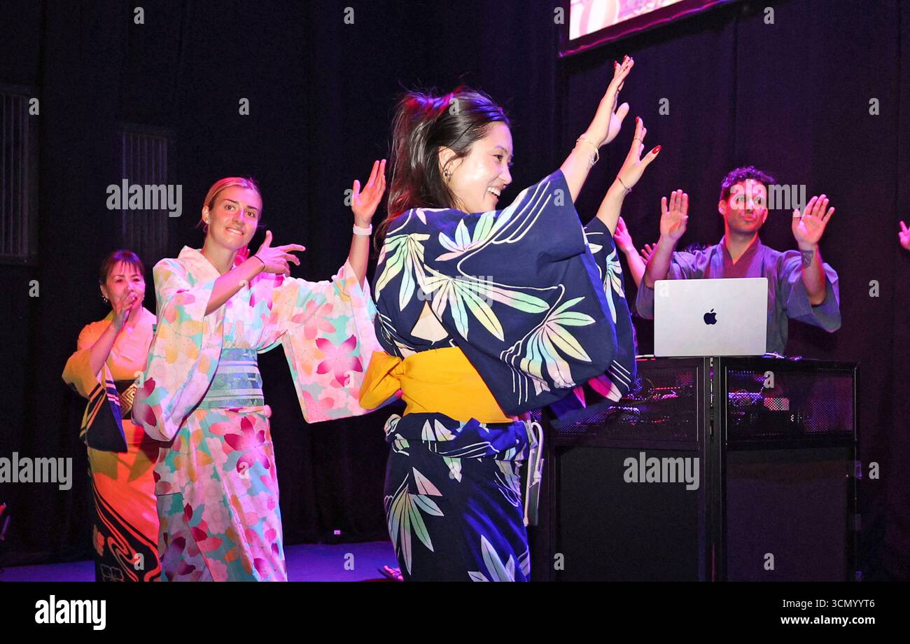 People enjoying Bon dance at the U.S. Pavilion of the Kansai Osaka Expo ...